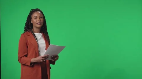 Reporting TV presenter in a studio again... | Stock Video | Pond5