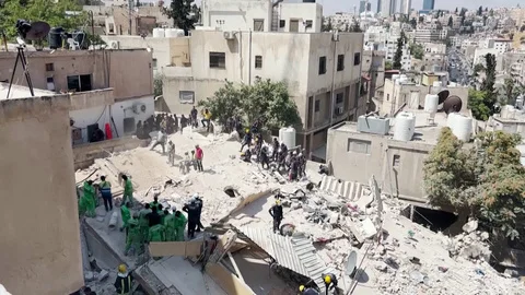 Rescue efforts after Jordan building col... | Stock Video | Pond5
