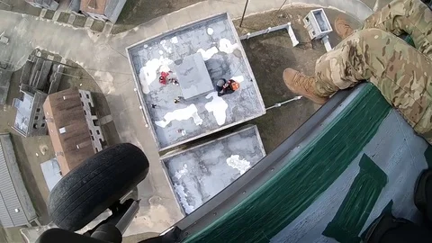 Rescue team soldier being lifted by heli... | Stock Video | Pond5