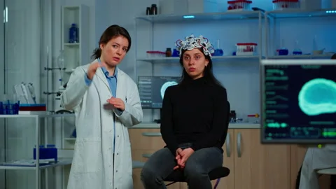 Researcher and patient with eeg headset ... | Stock Video | Pond5