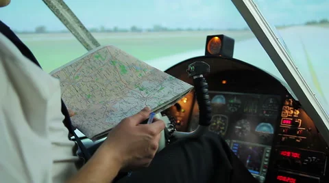 Responsible pilot looking at flight rout... | Stock Video | Pond5
