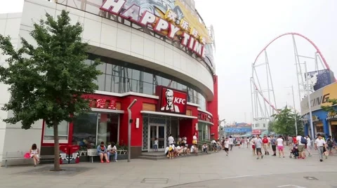 Restaurant KFC and roller coaster in the... | Stock Video | Pond5