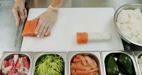 Restaurant kitchen. Male sushi chef prep... | Stock Video | Pond5