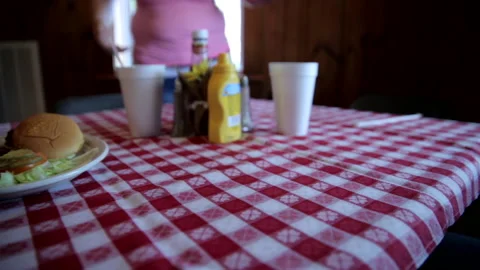 Restaurant server delivers food to diner... | Stock Video | Pond5