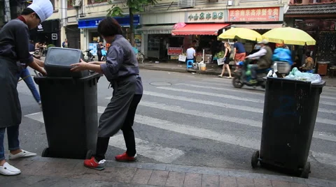 Restaurant workers throwing away garbage... | Stock Video | Pond5