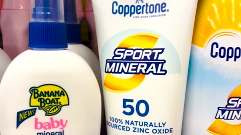 retail store Sun tan lotion on display c... | Stock Video | Pond5