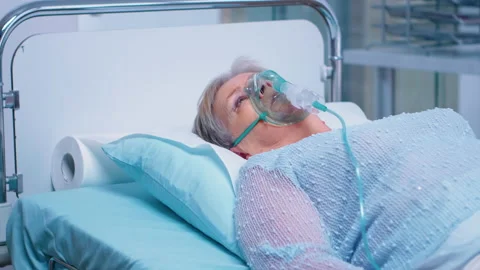 Retired old woman breathing with oxygen ... | Stock Video | Pond5
