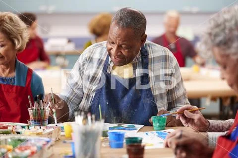 Retired Senior Man Attending Art Class In Community Centre Stock Photo ...