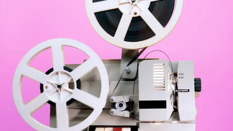 Retro reel with film rotating on pink st... | Stock Video | Pond5