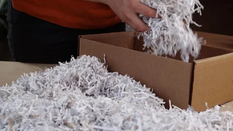 Reuse of shredded office paper as packin... | Stock Video | Pond5