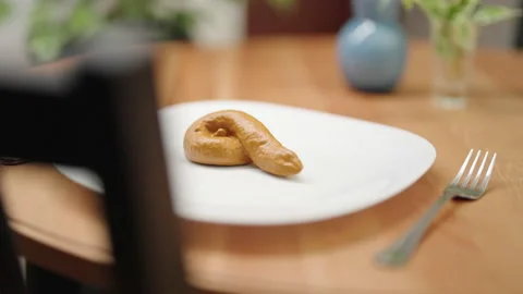 Reveal of shit on plate on kitchen table... | Stock Video | Pond5