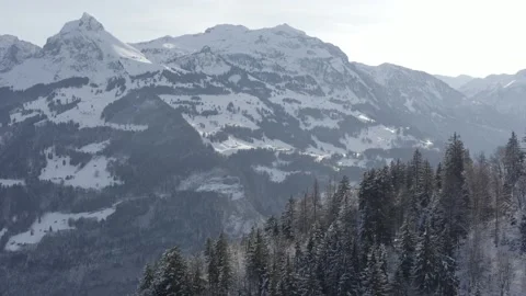 Revealing opening shot, flight over a mo... | Stock Video | Pond5