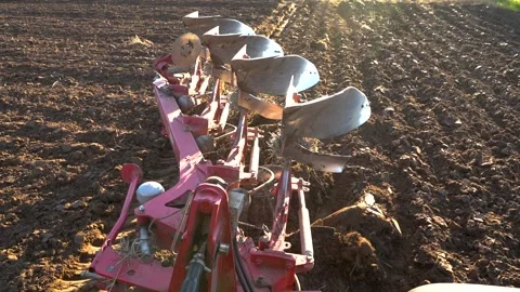 Reversible plough plowing ground in slow... | Stock Video | Pond5