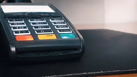 Review of the merchants pos terminal and... | Stock Video | Pond5