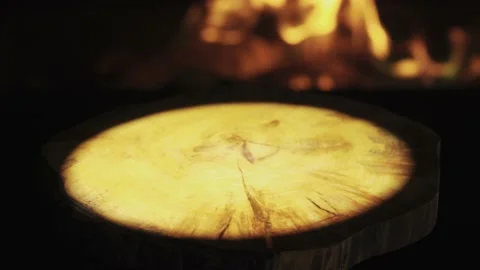 Revolving wooden food tray. Fire in the ... | Stock Video | Pond5