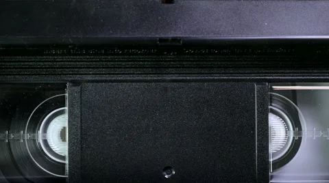 Rewind a VHS Tape into a VCR Player | Stock Video | Pond5