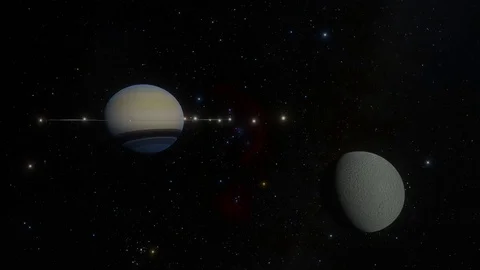 Rhea Moon and Saturn | Stock Video | Pond5