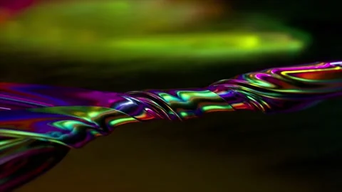 Ribbons of a metallic rainbow color are ... | Stock Video | Pond5