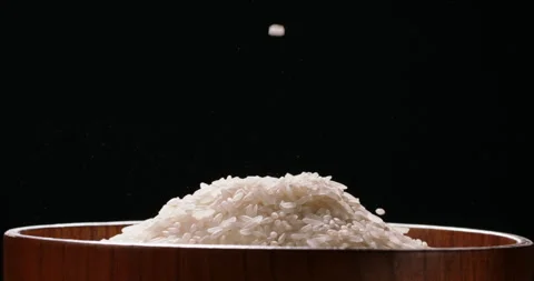 Rice being poured raw wooden cup side vi... | Stock Video | Pond5