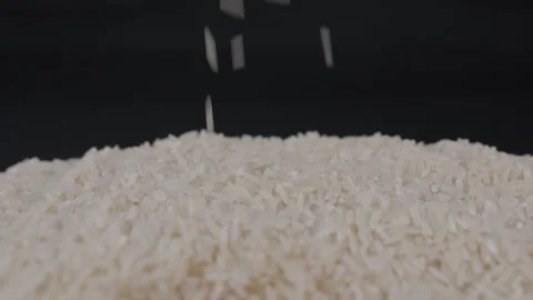 rice falling black background slow motio... | Stock Video | Pond5