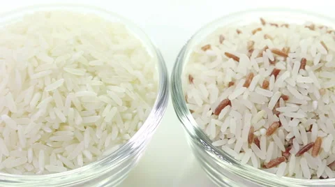 Rice in glass bowl on white background, ... | Stock Video | Pond5