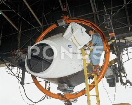 Richard F. Gordon Jr. climbing into training simulator. Astronaut ...