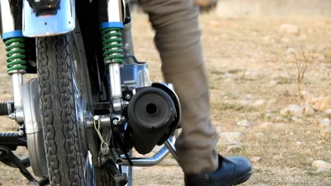 Rider Kick Starting His Bike And Going A... | Stock Video | Pond5