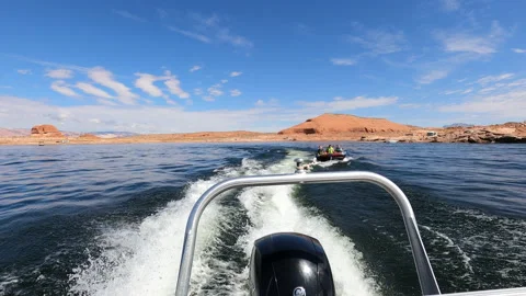 Riding float tube behind speeding boat L... | Stock Video | Pond5