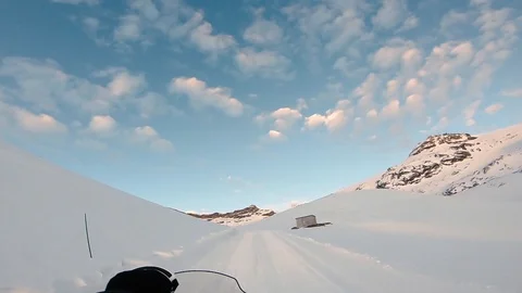 Riding a snowmobile with a trolley attac... | Stock Video | Pond5