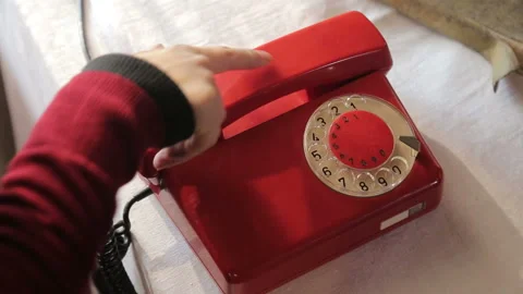 Ringing a red Rotary dial telephone | Stock Video | Pond5