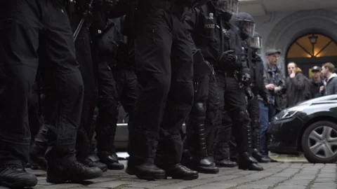 Riot police officers boots retreat, radi... | Stock Video | Pond5