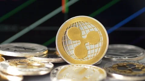 Ripple Coin With Charts and Graphs in th... | Stock Video | Pond5