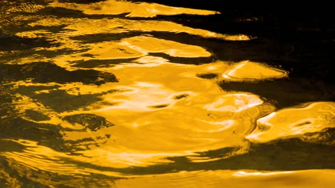 Ripple of water golden water waves surfa... | Stock Video | Pond5