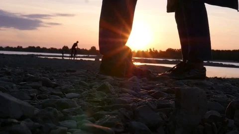 Rise to the socks at sunset by the river... | Stock Video | Pond5