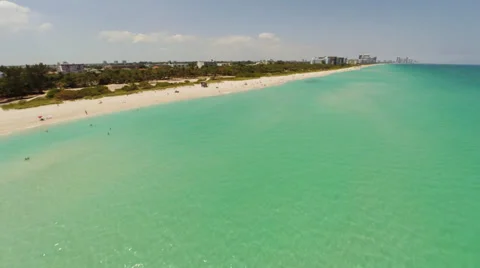 Rising above the beaches of Miami Beach,... | Stock Video | Pond5