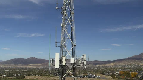 Rising aerial view of cell tower in city... | Stock Video | Pond5