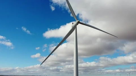 Rising view of a rotating wind turbine w... | Stock Video | Pond5