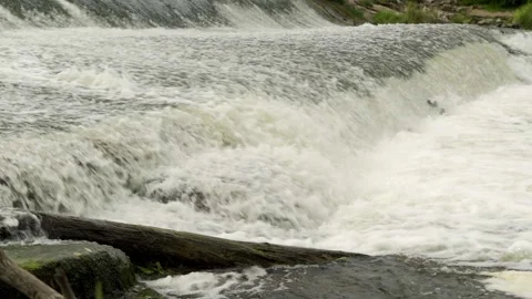 River dam. The water flows out of the da... | Stock Video | Pond5