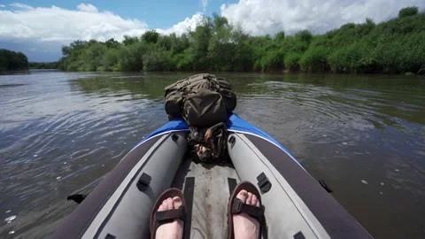 River kayaking POV shot with the toes of... | Stock Video | Pond5