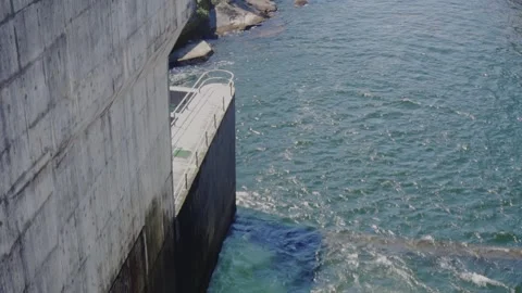 river passing trough a dam Details | Stock Video | Pond5