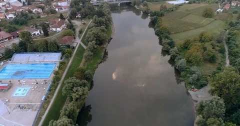River, swimming pool. Sky reflects in th... | Stock Video | Pond5