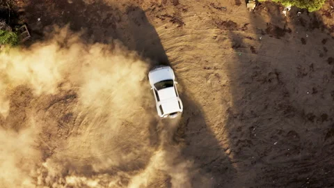 Off-road car is making donuts burnout on... | Stock Video | Pond5