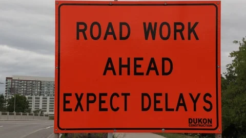 Road construction caution signs on city ... | Stock Video | Pond5
