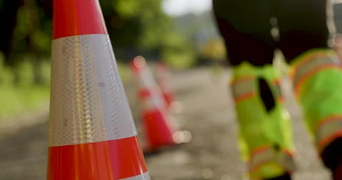 Road Construction Flagger Placing Traffi... | Stock Video | Pond5