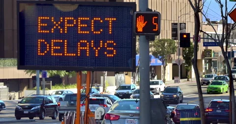 Road construction sign during rush hour ... | Stock Video | Pond5