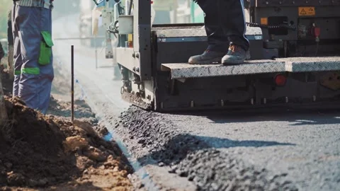 Road paving machine stacking asphalt roa... | Stock Video | Pond5