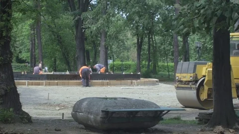 Road roller flatten ground on the road b... | Stock Video | Pond5