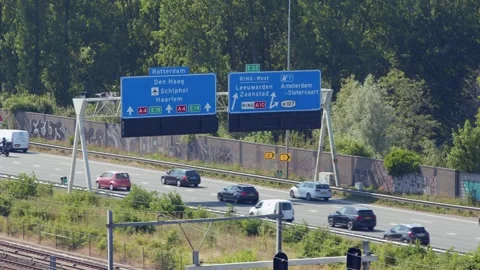 Road Signs Above Vehicles Driving On A10... | Stock Video | Pond5