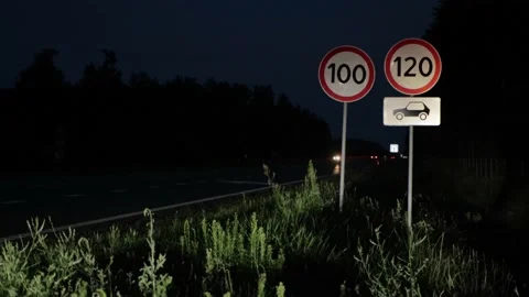 Road signs of speed limit at night on th... | Stock Video | Pond5