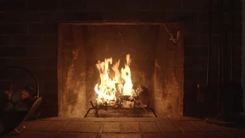 Roaring log fire burning in a brick fire... | Stock Video | Pond5